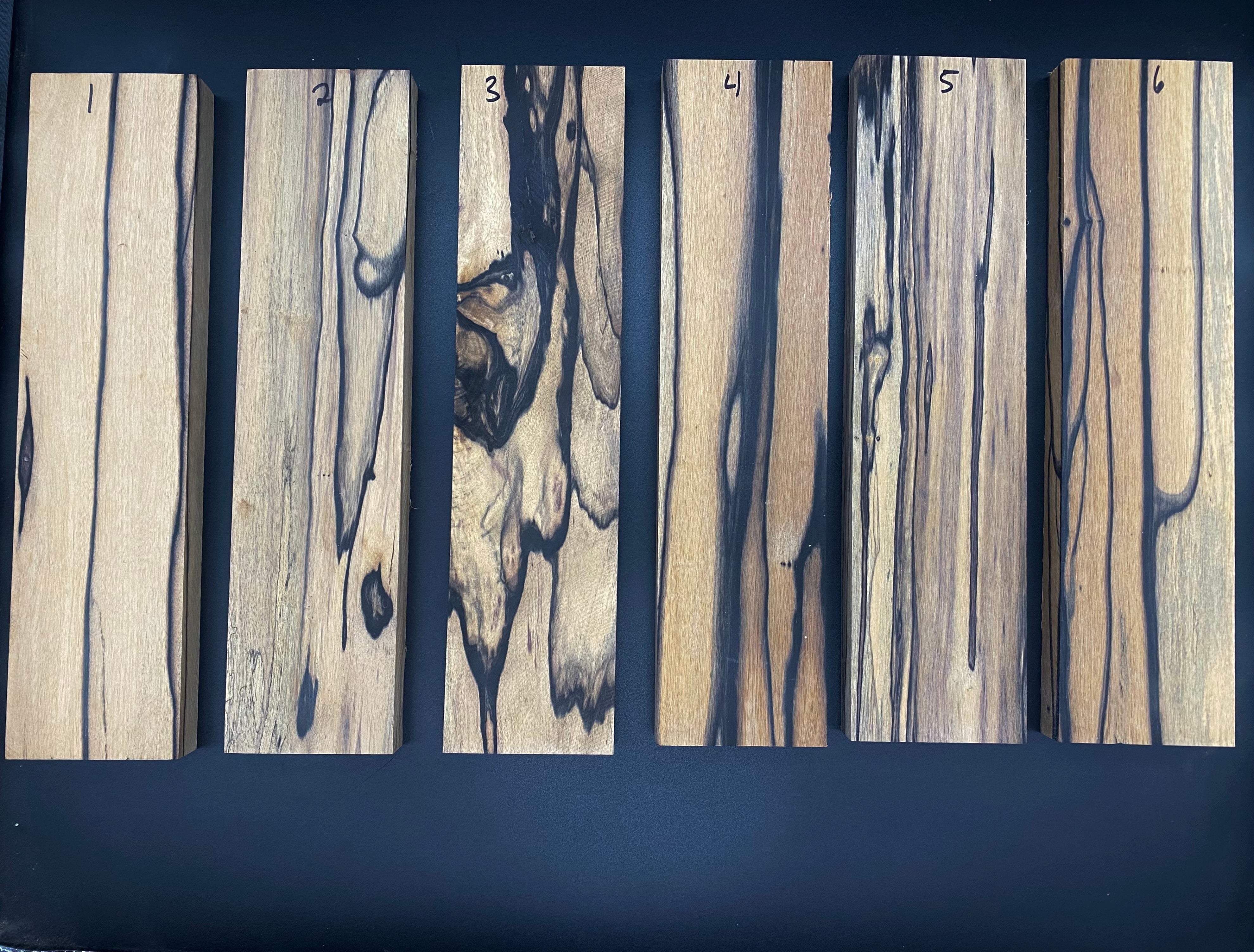 Custom Wood Selection - Black & White Ebony – Badger Custom Grips